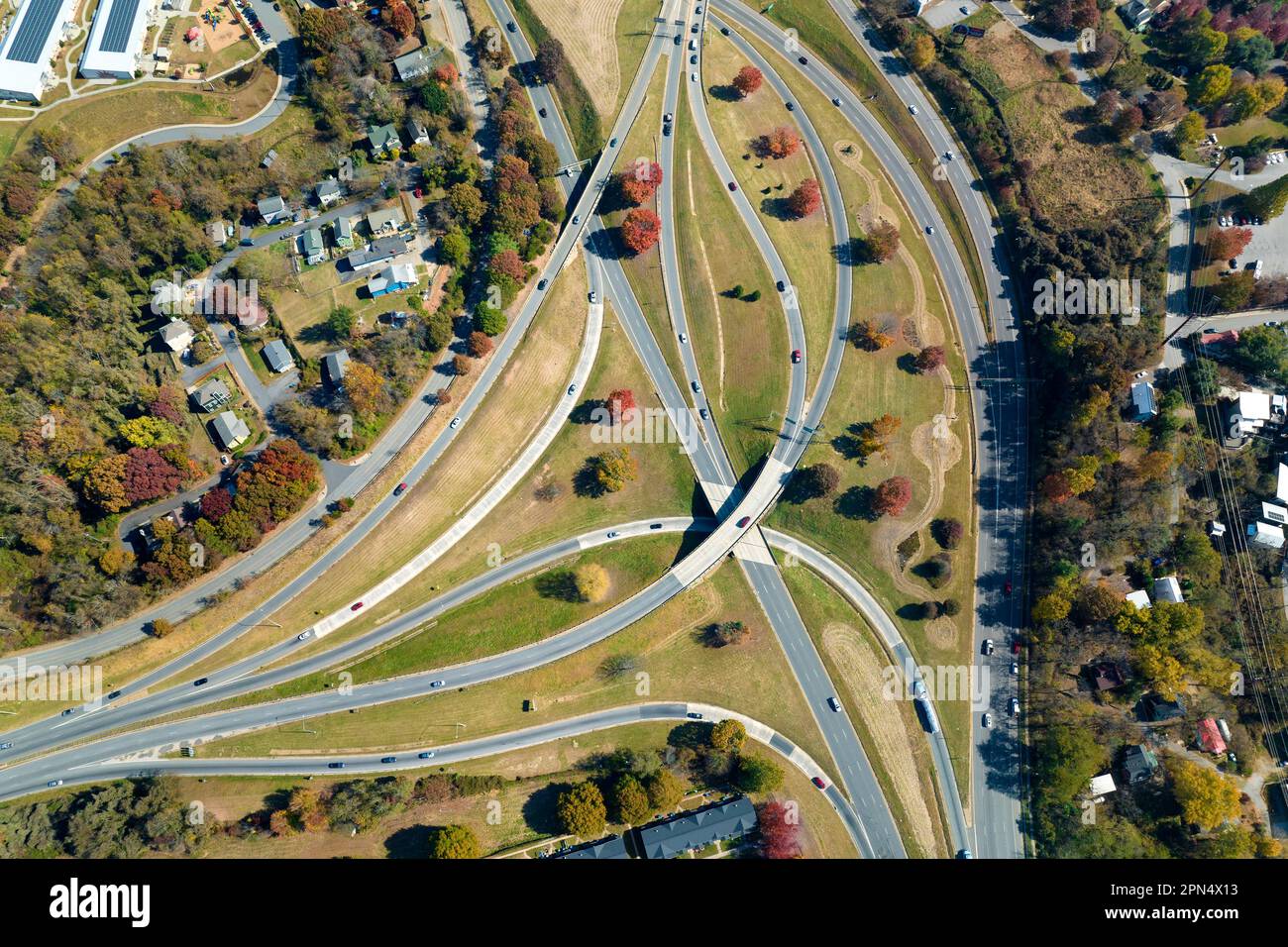 Aerial view of american freeway intersection with fast moving cars and ...