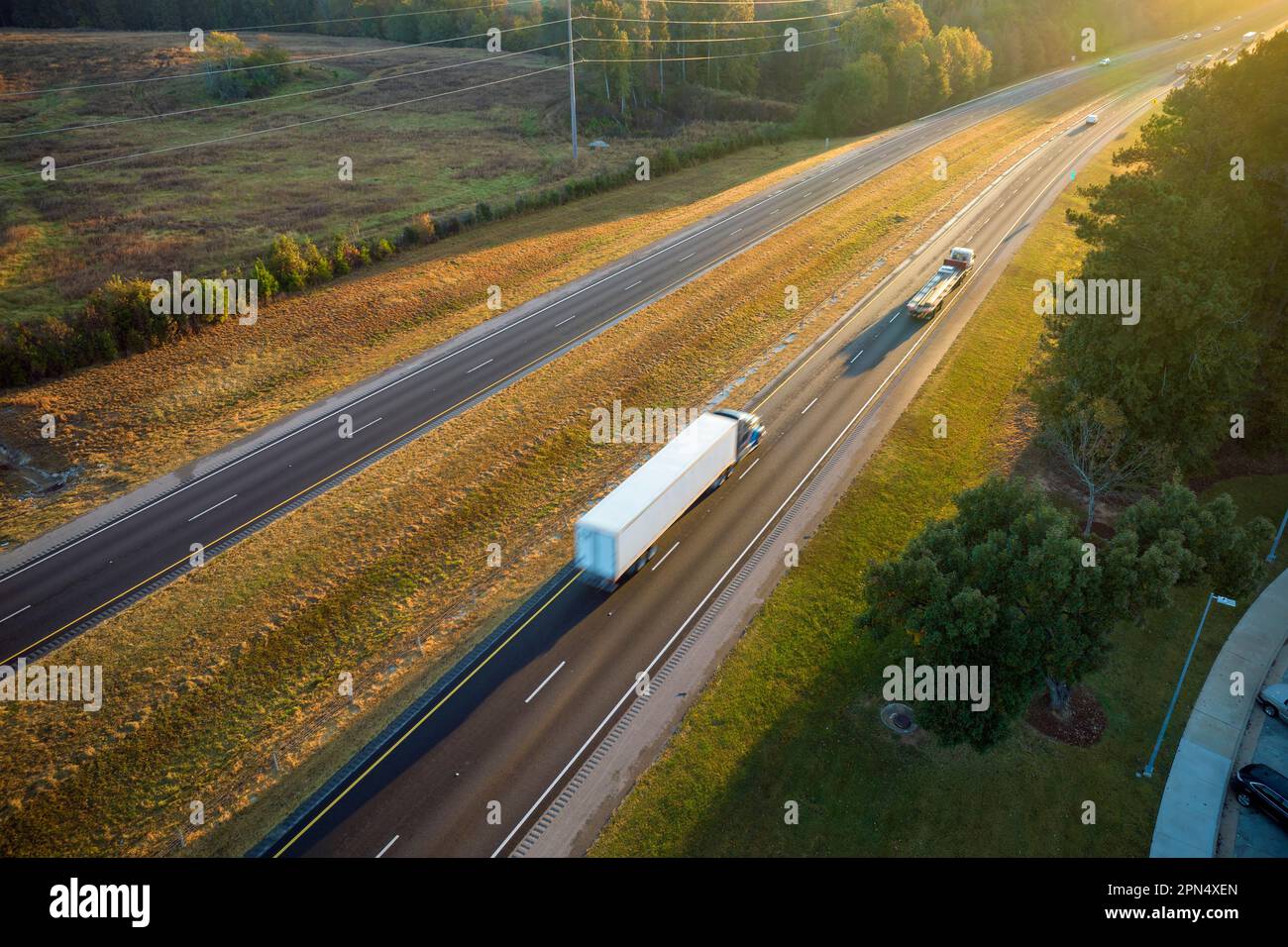 Aerial view of busy american freeway with fast moving cars and trucks ...