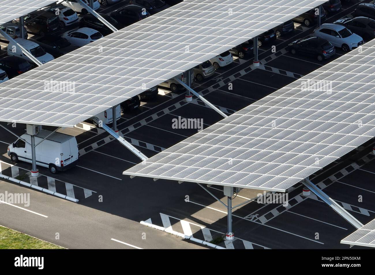 Aerial view of solar panels installed as shade roof over parking lot ...
