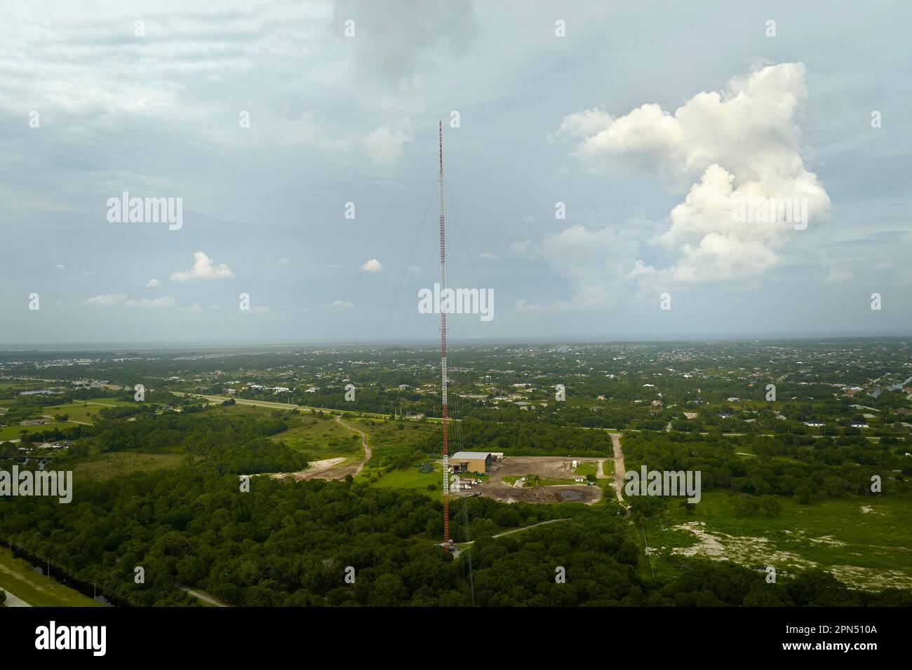 Aerial view of telecommunications cell phone tower with wireless communication 5g antennas for ...