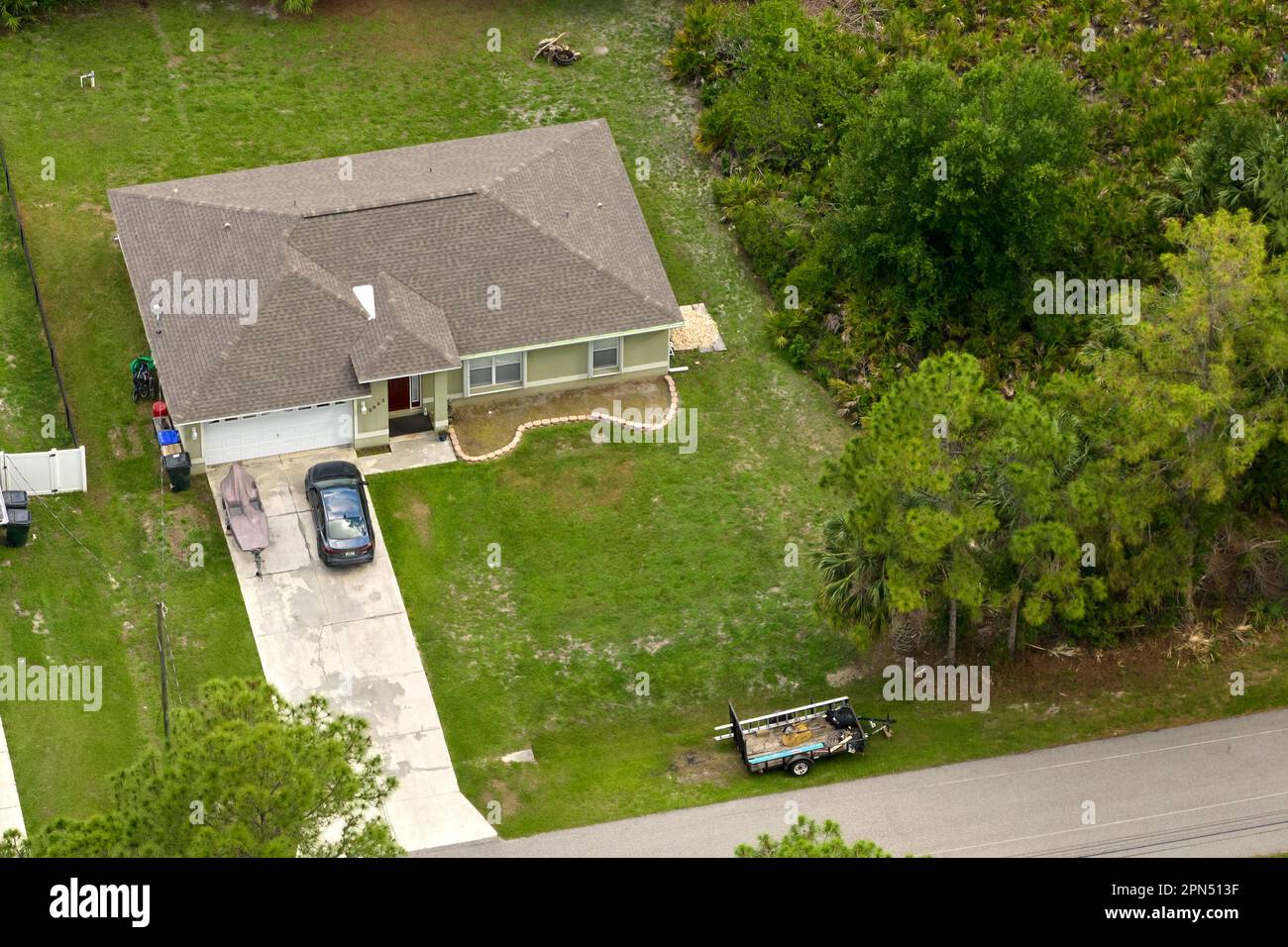 Aerial view of typical contemporary american private house with roof ...