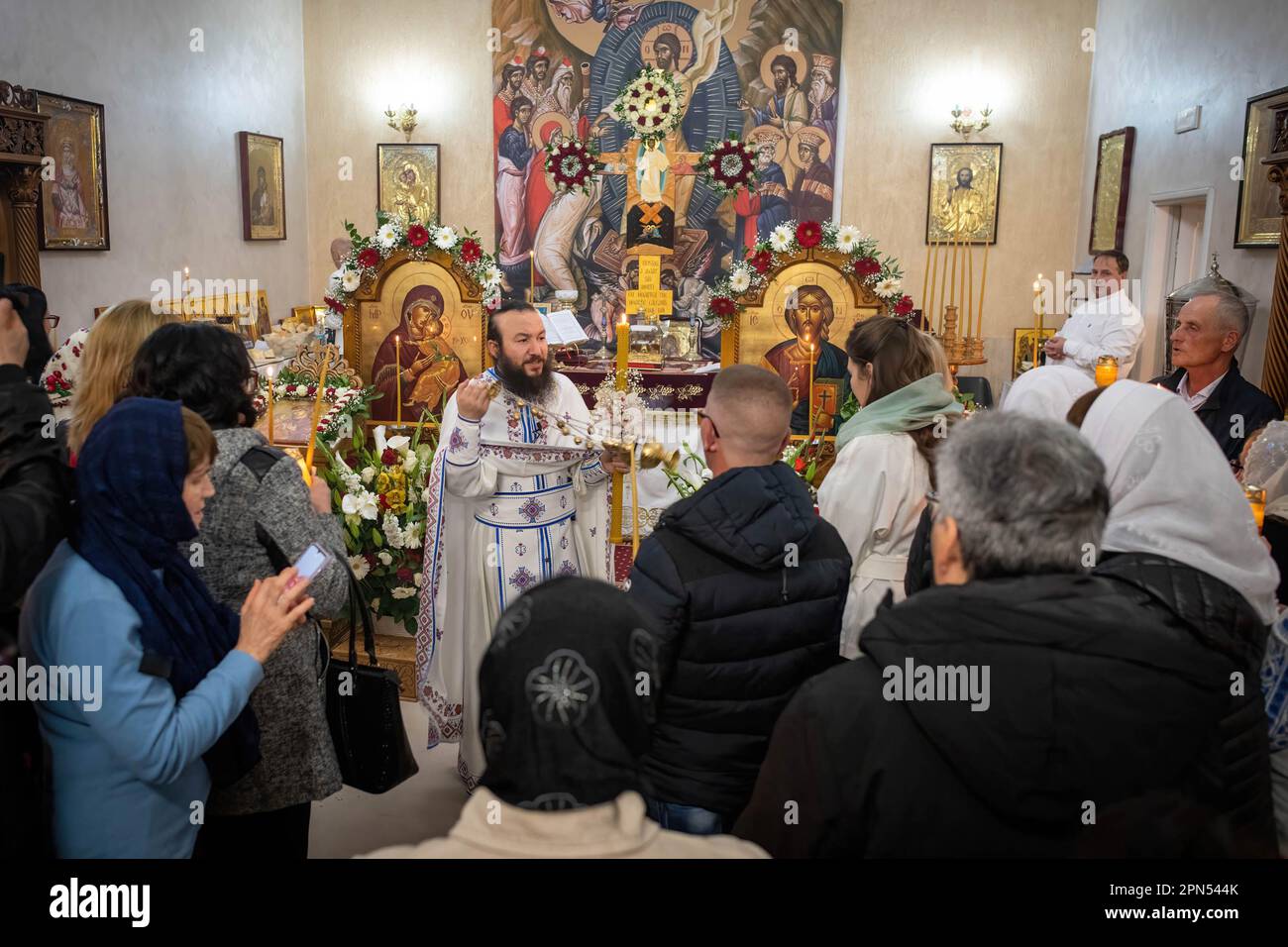 Pr. Daniel officiating the religious ceremony with the faithful who ...