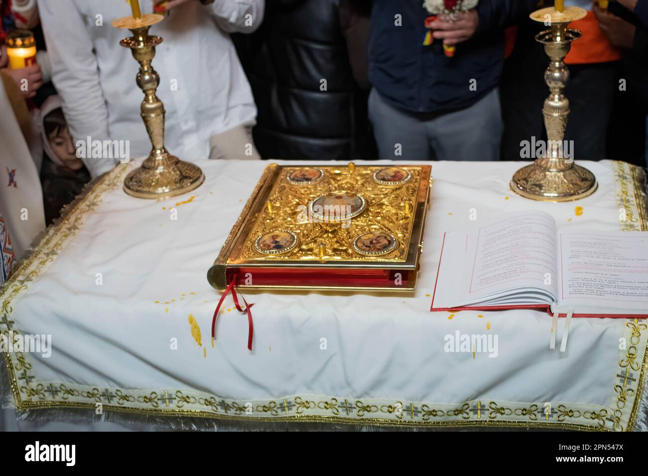 Pr. Daniel officiating the religious ceremony with the faithful who ...
