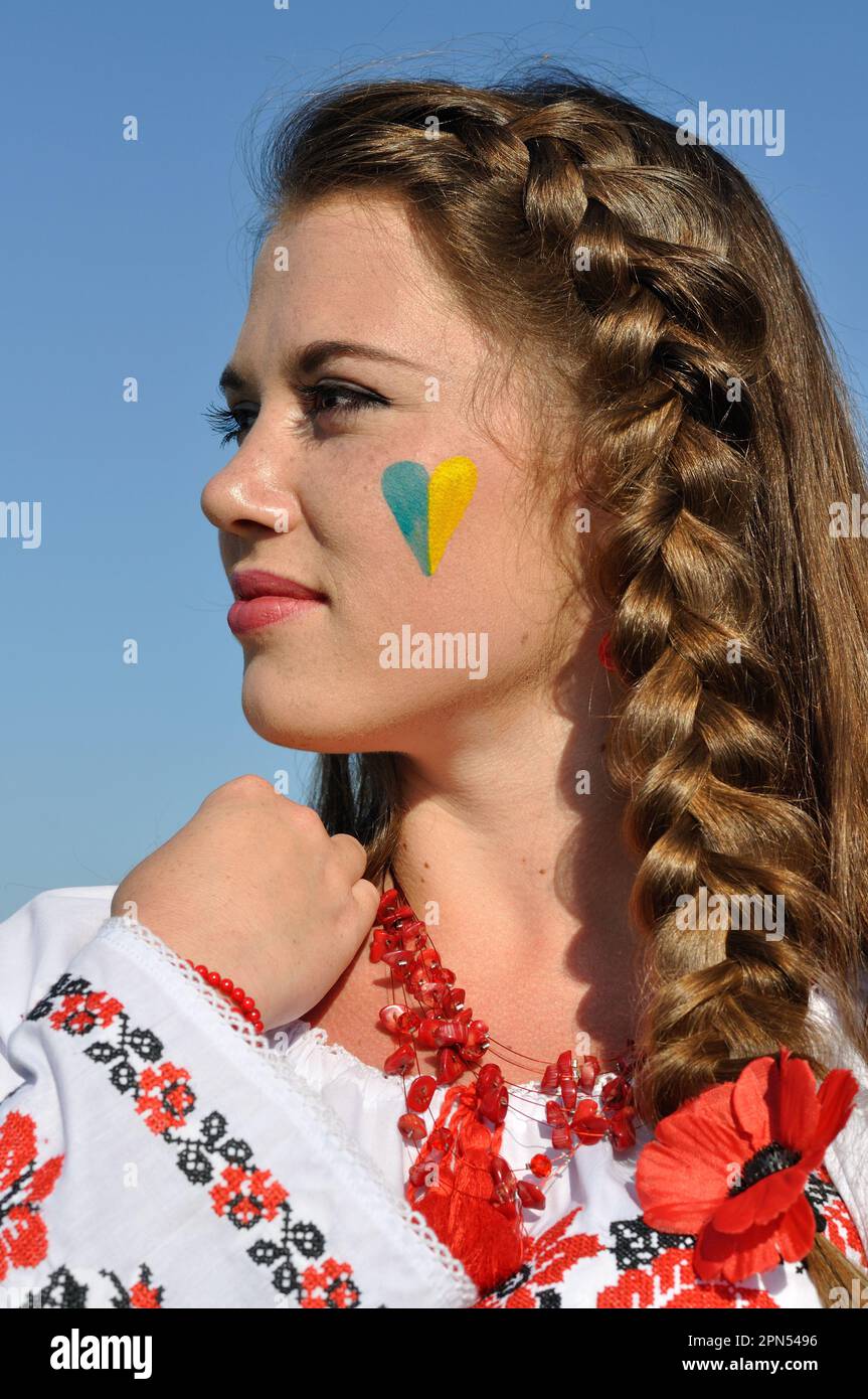 outdoor portrait of young ukrainian woman in traditional ukrainian ...