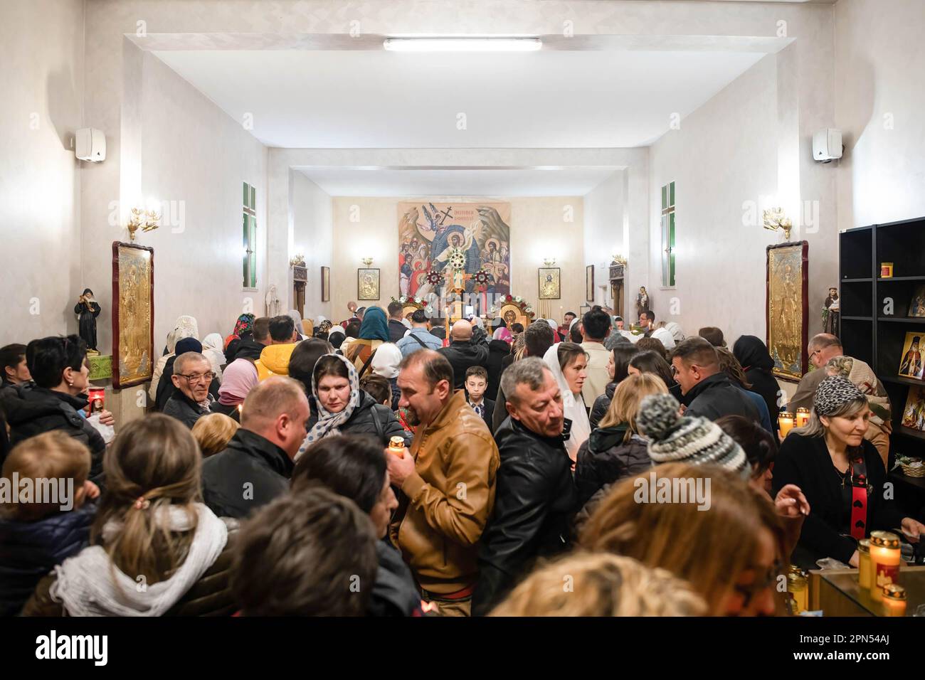 Faithful seen inside the church of the Annunciation. The faithful of ...