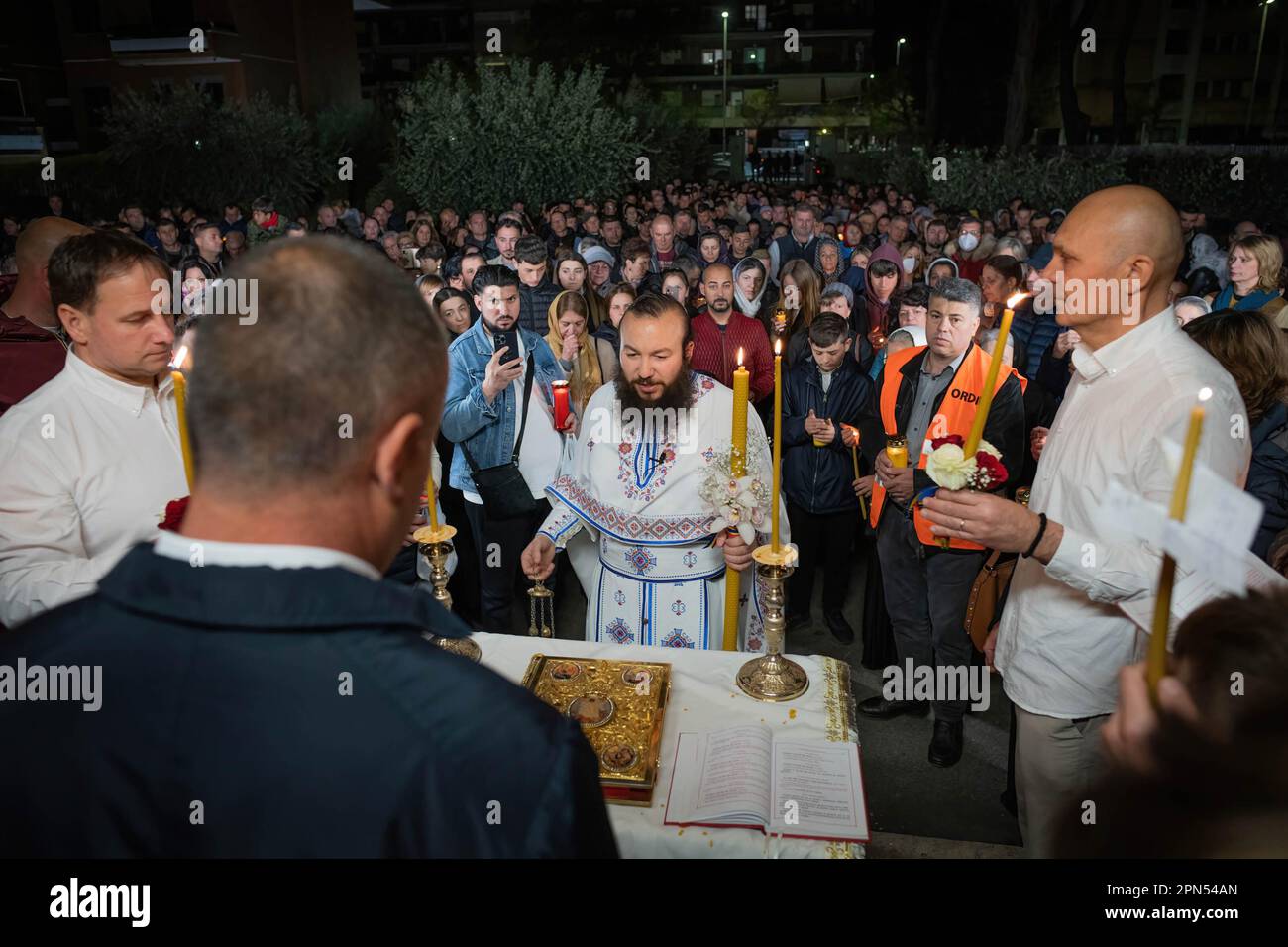 Pr. Daniel officiating the religious ceremony with the faithful who ...