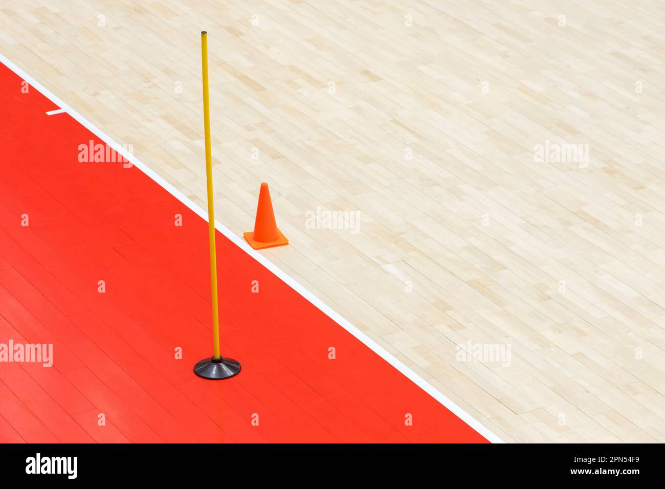 Training cones on hardwood court floor. Basketball, futsal, handball ...