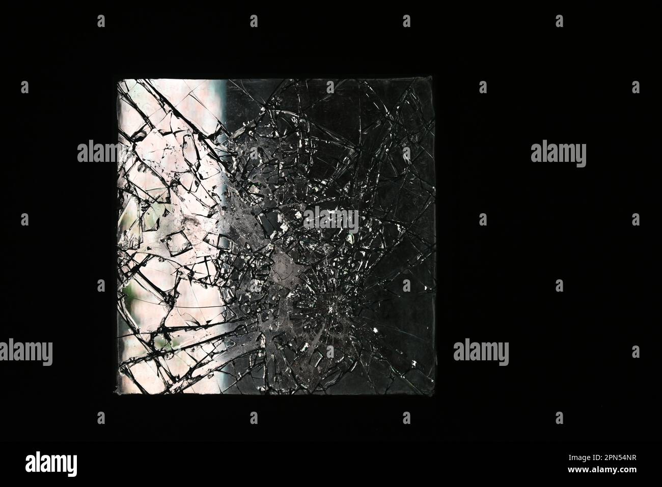 A broken window pane in a doorway at a school abandoned since 2001 ...