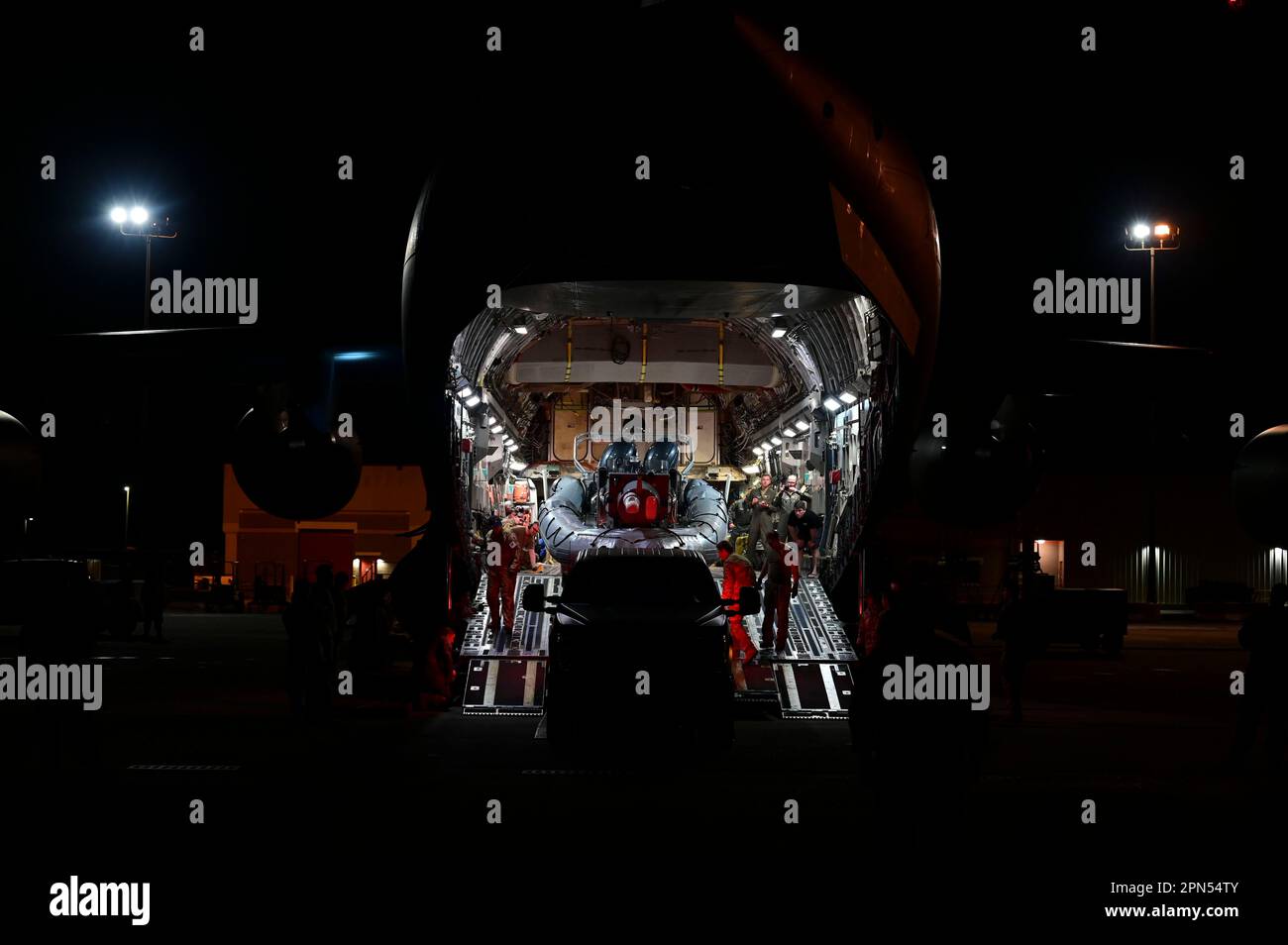 Aircrew assigned to the 144th Airlift Squadron, unload a 212th Rescue ...