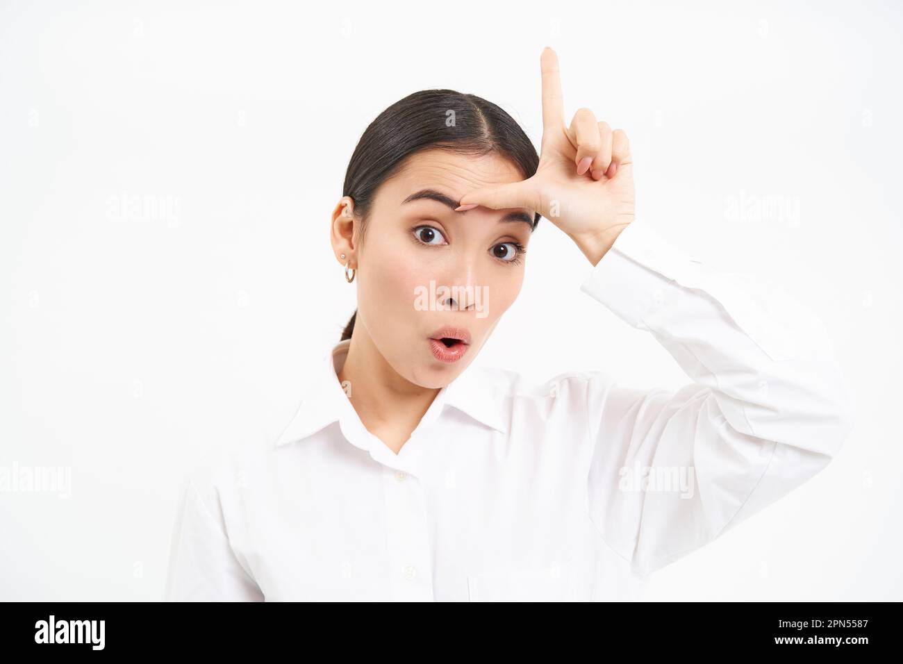 Failure. Close up portrait of korean business woman shows L letter ...