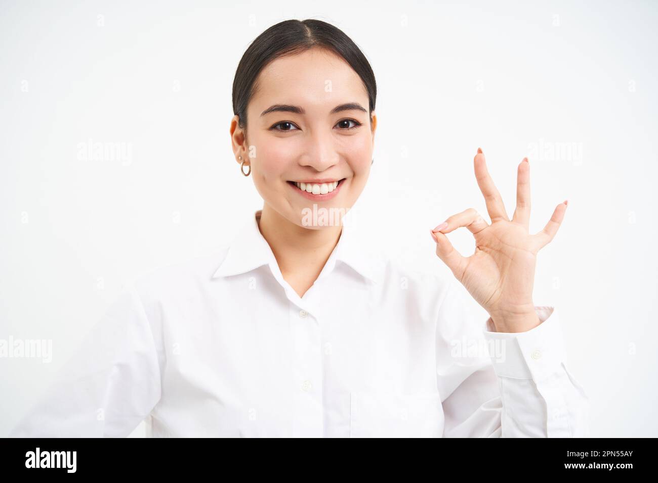 Confident saleswoman, team leader shows okay, ok sign in approval, say ...