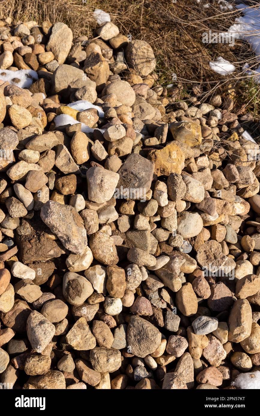 a pile of stones collected after clearing the field for sowing, stones ...