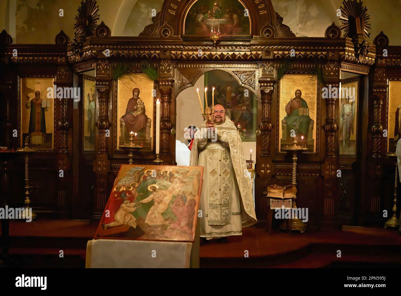 The Orthodox Priest Georges Ashkov, at the altar with a three-armed ...