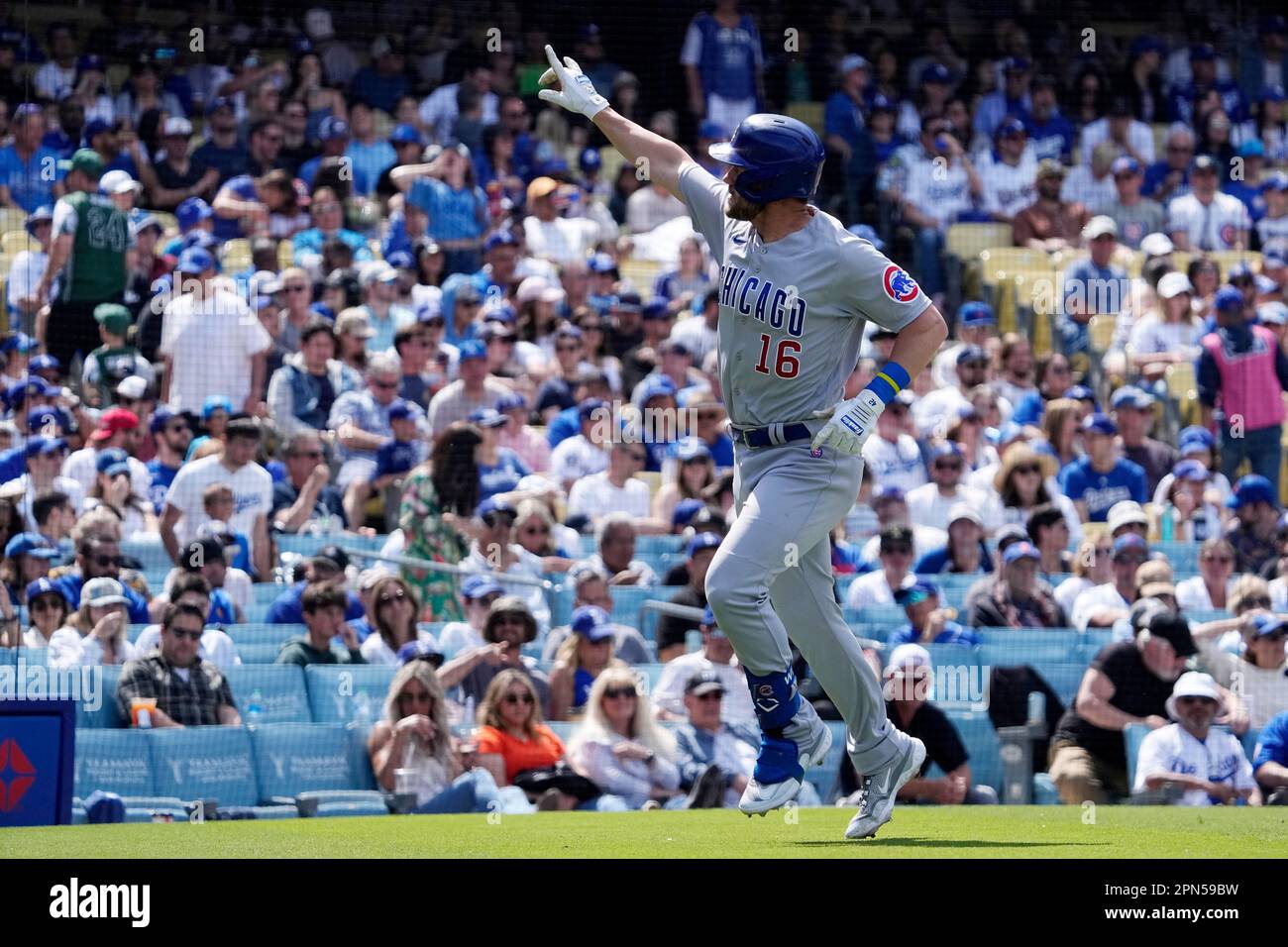 Chicago Cubs' Patrick Wisdom gestures after hitting a solo home run ...