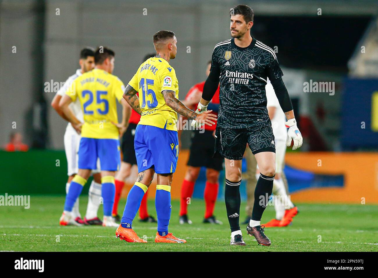 Thibaut Courtois of Real Madrid and Roger Marti of Cadiz during the La ...