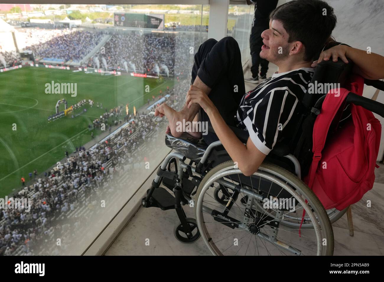 Hamilton Moreira, 16, with autism spectrum disorder, watches a ...