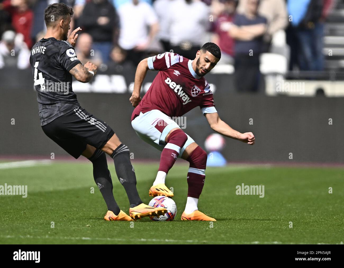 London, UK. 16th Apr, 2023. Said Benrahma (West Ham) and Ben White ...