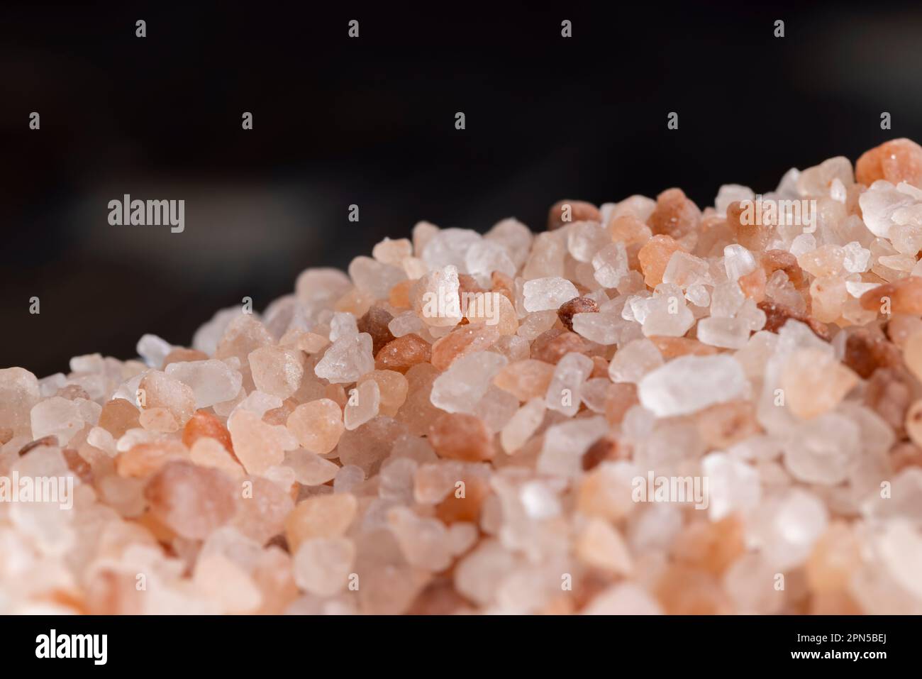 A large number of pink salt crystals of different sizes, a lot of pink ...