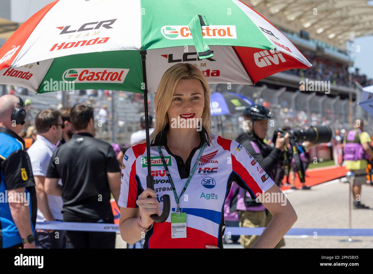AUSTIN, TX - APRIL 16: LCR Honda Castrol grid girl awaits the riders ...