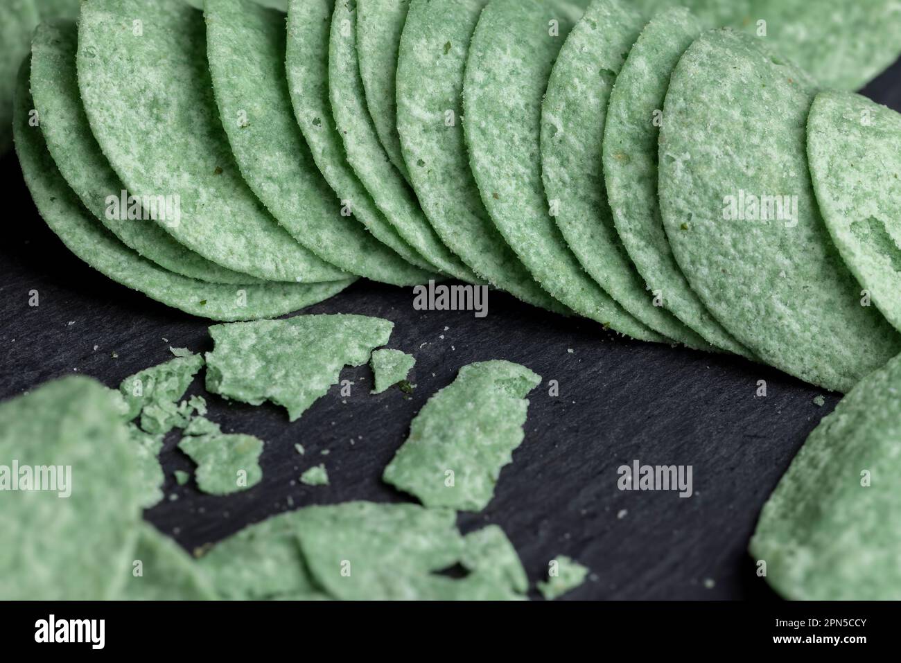 Thin and delicious green potato chips, crispy green chips with pepper ...