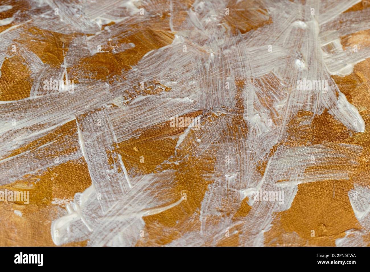 Abstract background painted with yellow and white paints, close-up of a ...