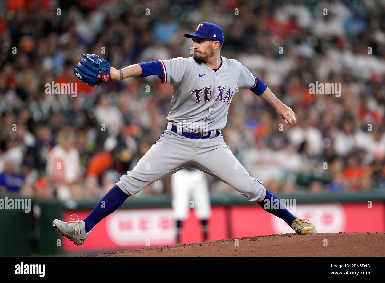 Texas Rangers starting pitcher Andrew Heaney throws against the Houston ...