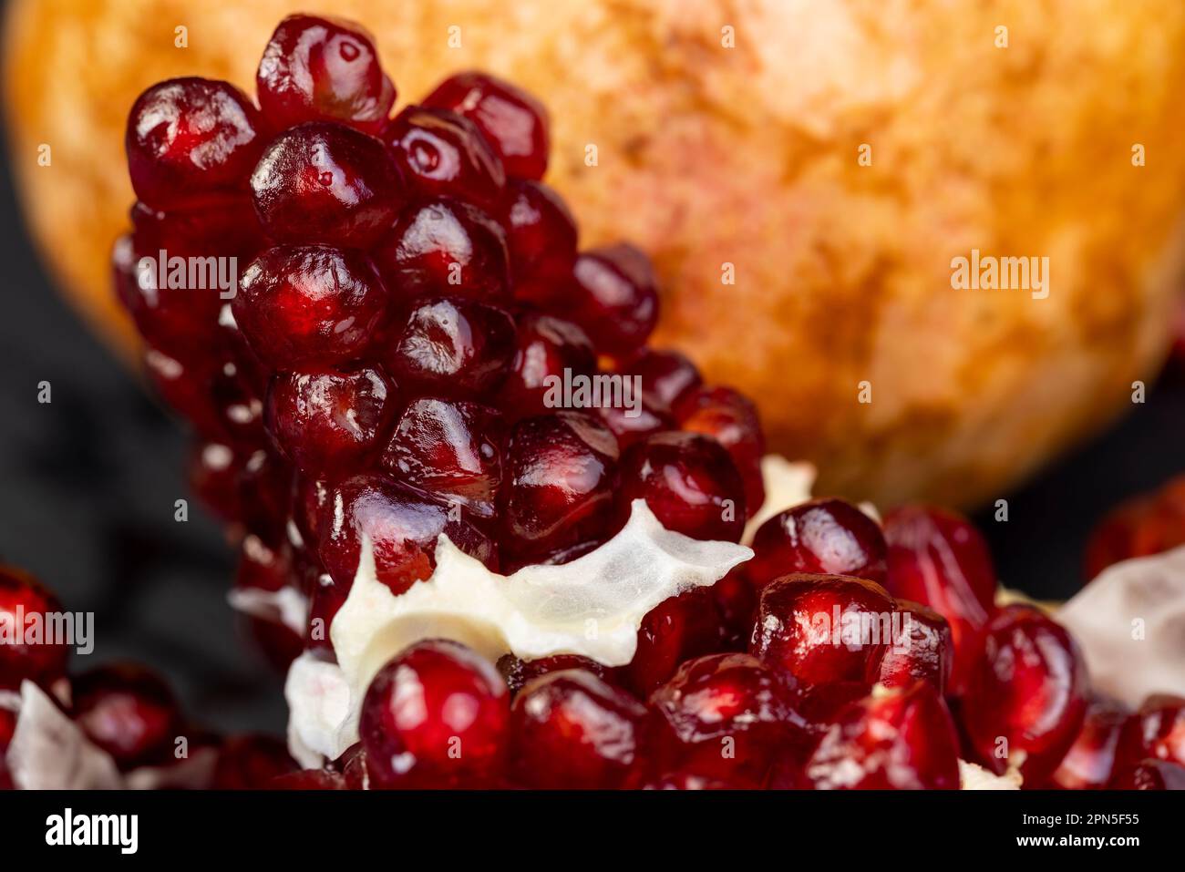 peeled red ripe pomegranate with red sweet grains, juicy pomegranate ...