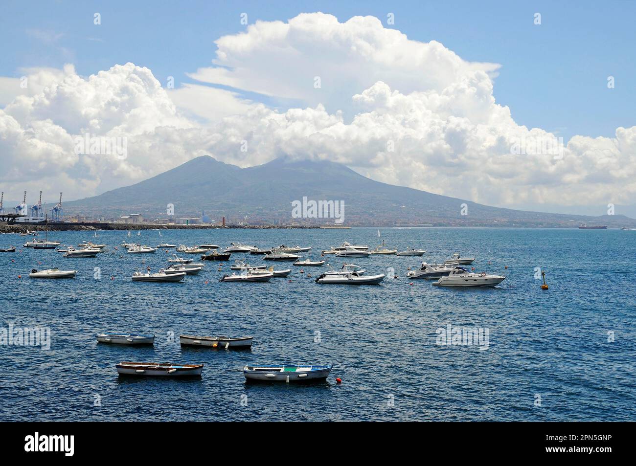 Small boats, harbour, volcano Vesuvio in the background, Naples ...