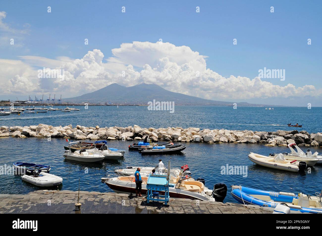 Small boats, harbour, volcano Vesuvio in the background, Naples ...
