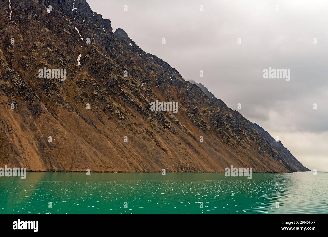 Barren Slopes Running Into an Aqua Sea at Lilliehookfjorden in teh ...