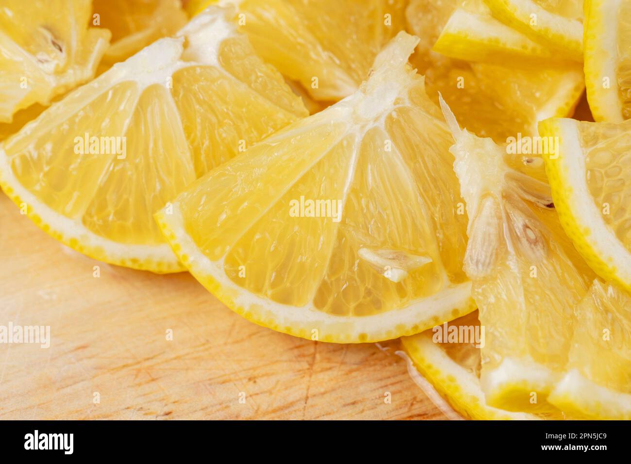 Juicy ripe lemon cut into pieces, ripe lemon with lots of juice sliced ...