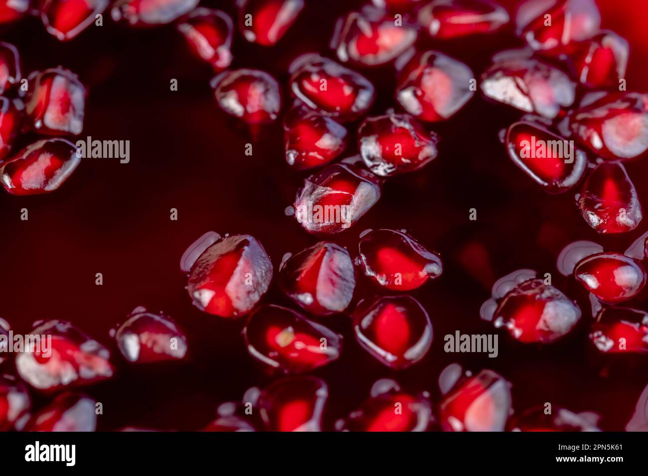 peeled red ripe pomegranate with red sweet grains, juicy pomegranate ...