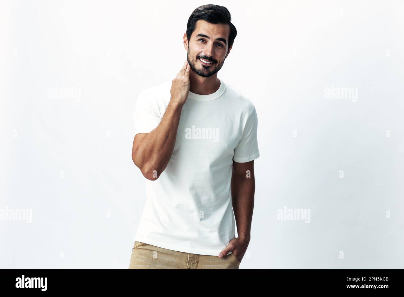 Male fashion model in a white t-shirt and jeans, smile with teeth joy ...