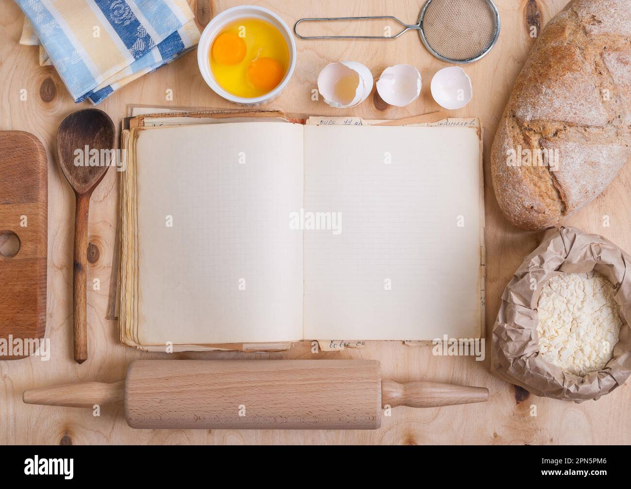 Baking light warm background with blank cook book, cutting board ...