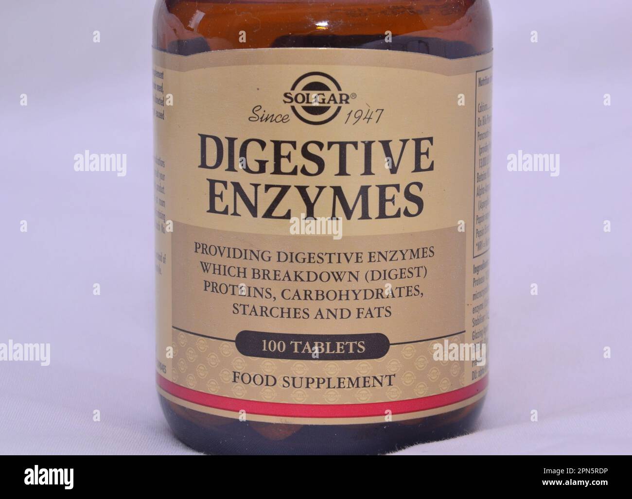 Stock image photo of a bottle of digestive enzymes with a label saying ...