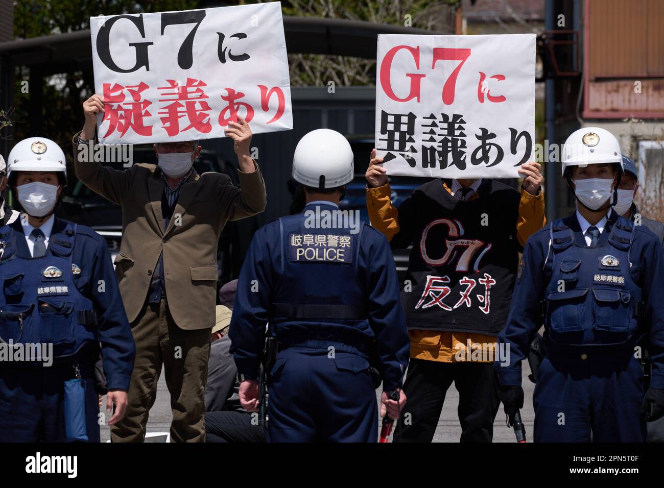 Karuizawa, Japan. 16th Apr, 2023. Protesters holding placards are ...
