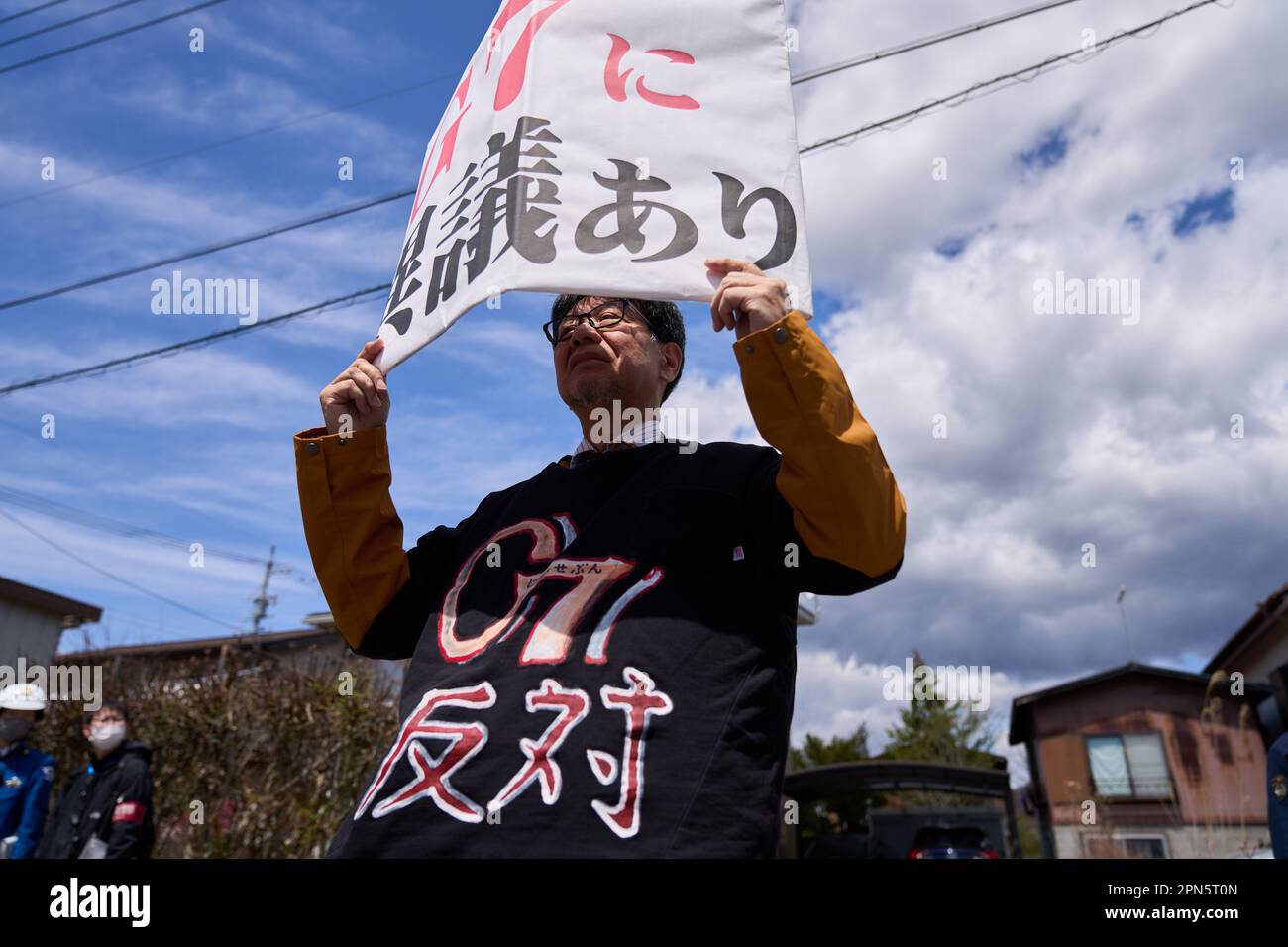 Karuizawa, Japan. 16th Apr, 2023. A protester holding a placard is ...