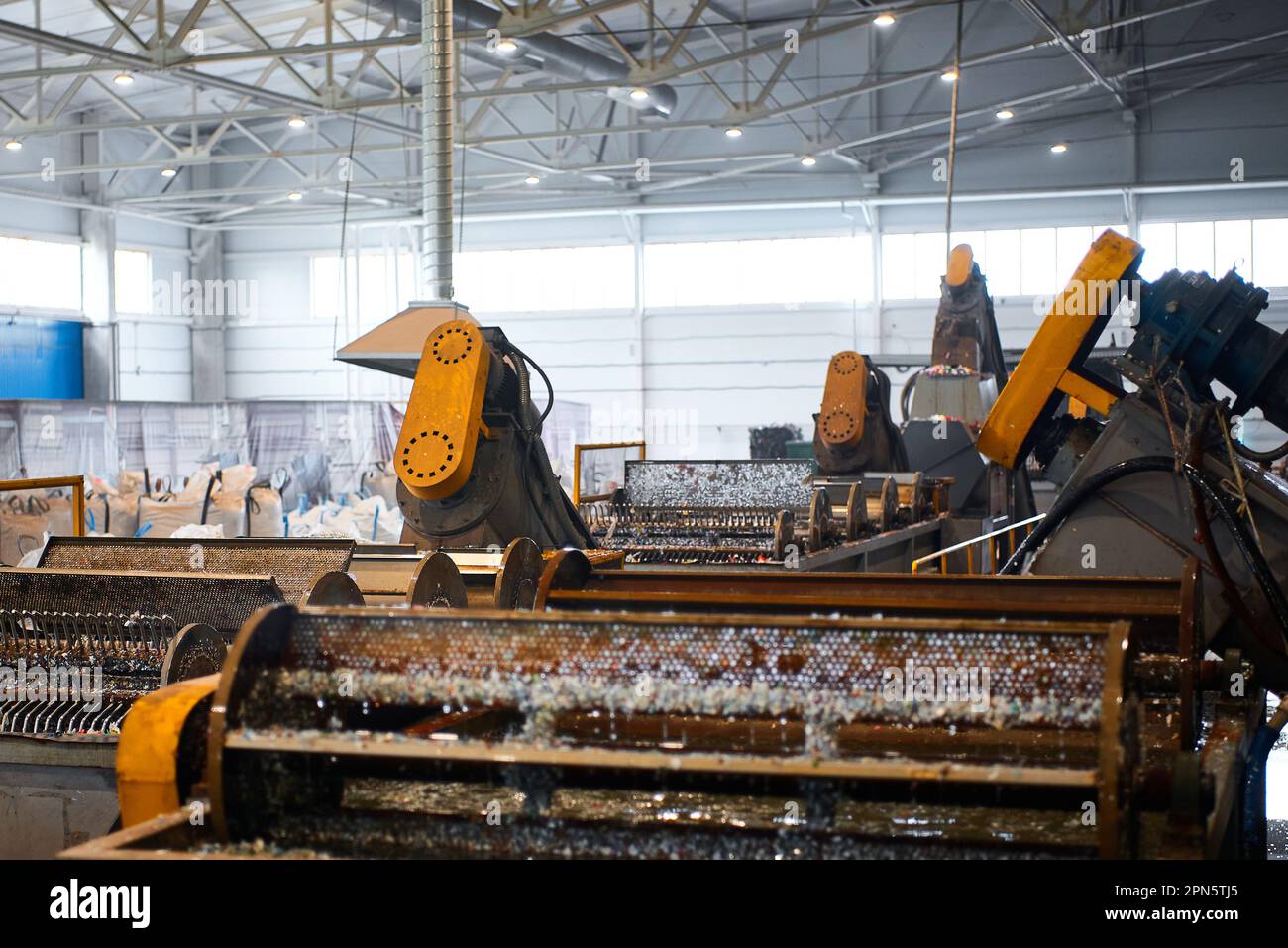 Waste plastic chopping machine operates in plant workshop Stock Photo ...