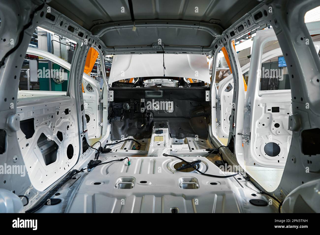 New empty automobile body in facrory assembling workshop Stock Photo ...