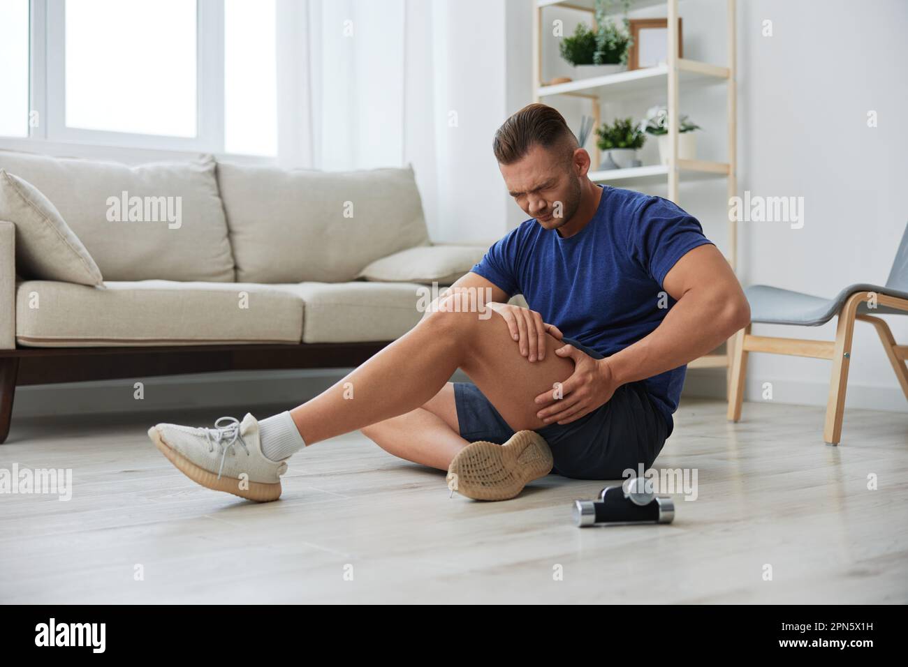 Man athlete pain and injury back arm and leg at home, sports injury ...