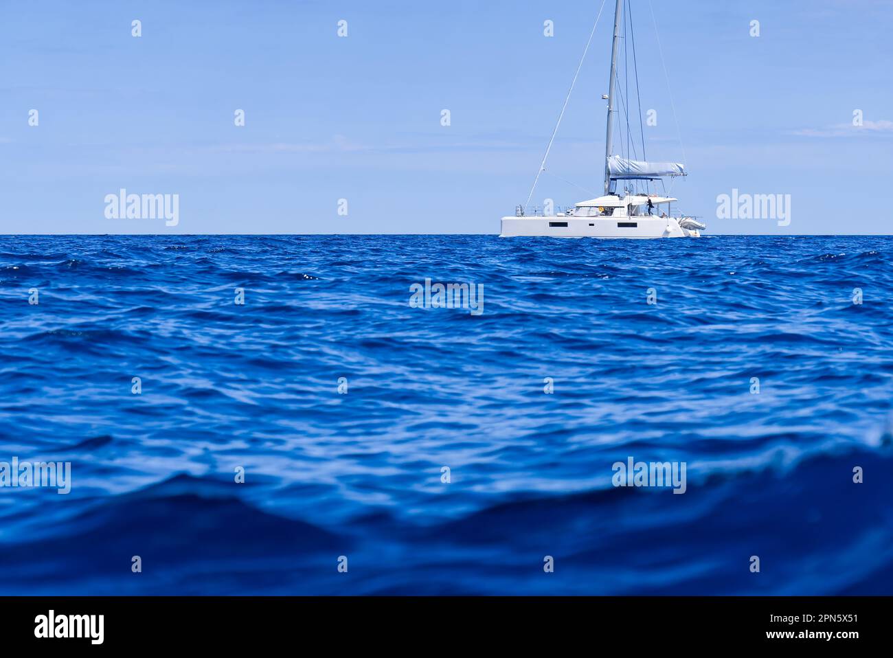 Yacht catamaran on the sea. Catamaran sailing on turquoise waters ...