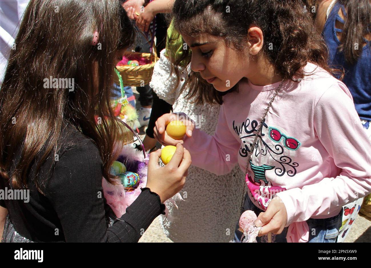 Hasbaya, Lebanon. 16th Apr, 2023. Two girls play egg tapping during the ...