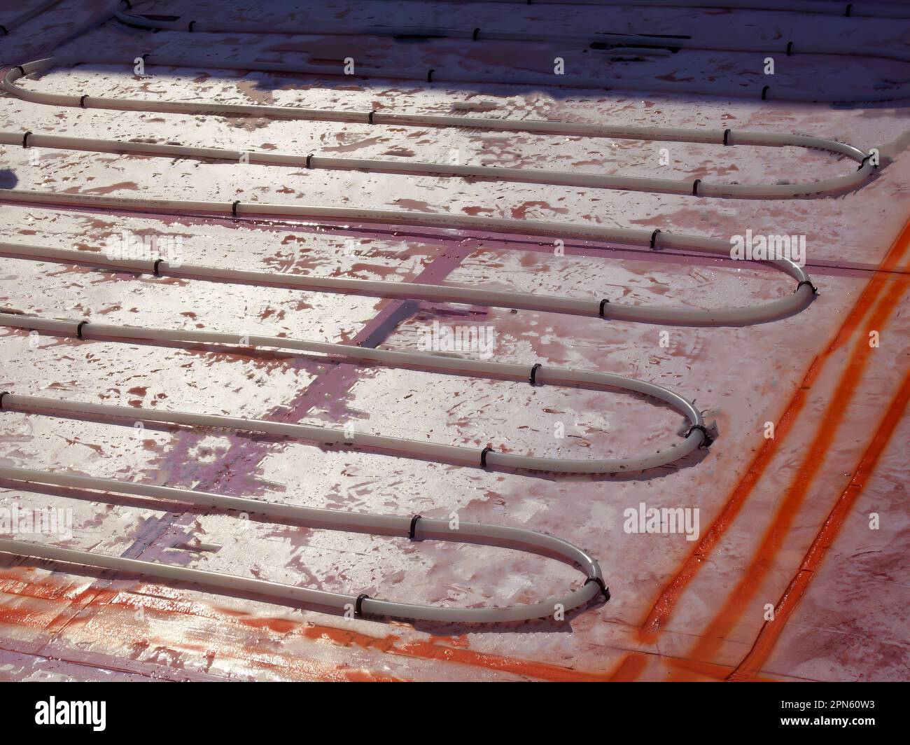 Loops of in-floor heat coils read for installation on polystyrene foam ...