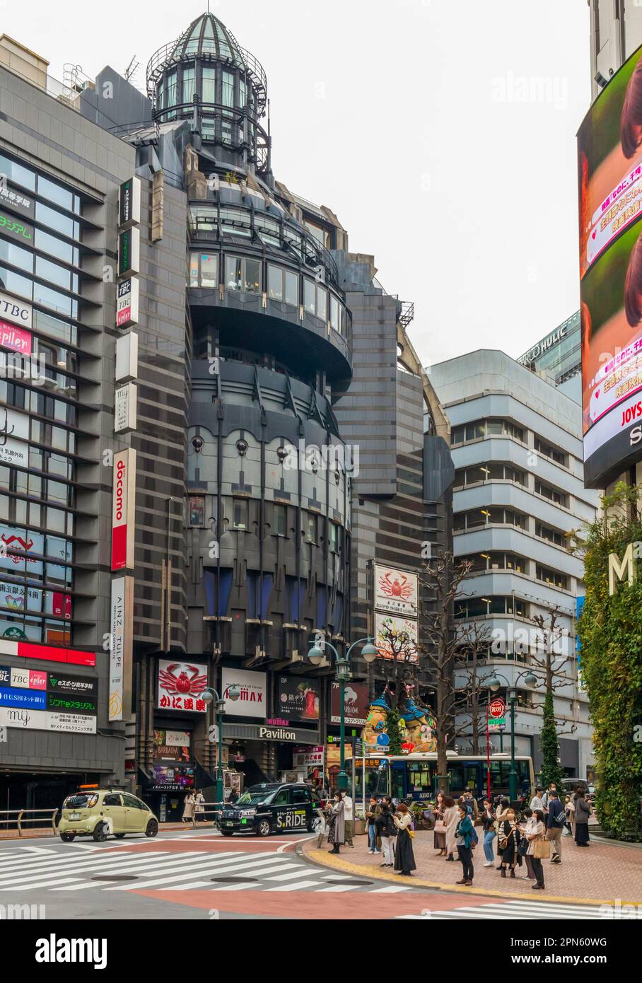 Tokyo, Japan - March 21, 2023: People walking along the busy streets ...