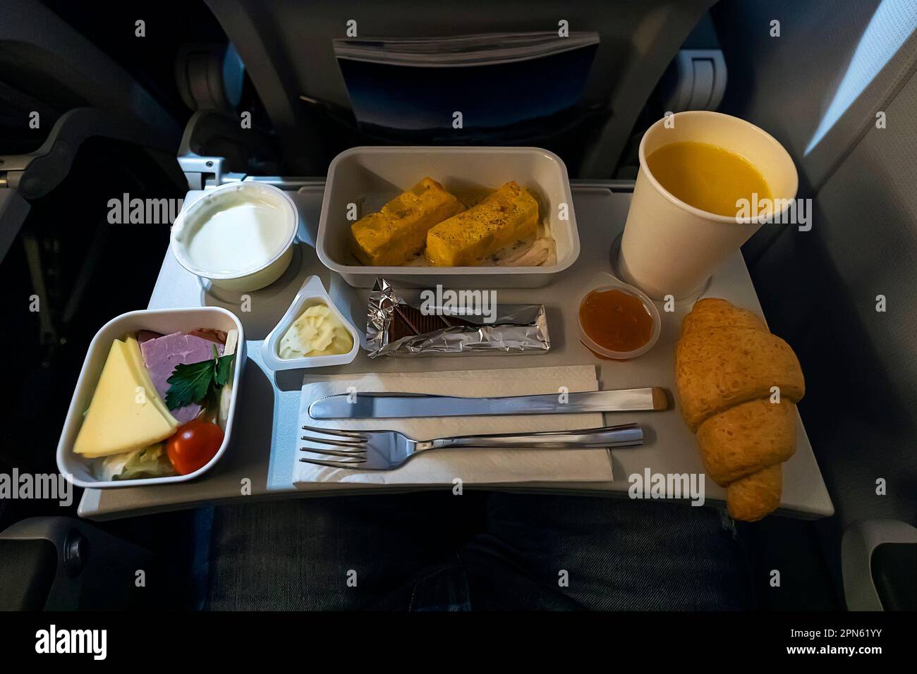 cheese vegetables bread omelet and other food on the folding table ...