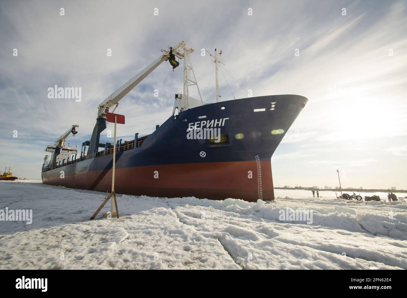 April, 2023 - Arkhangelsk. Huge cargo ship "Bering" among the white ice ...