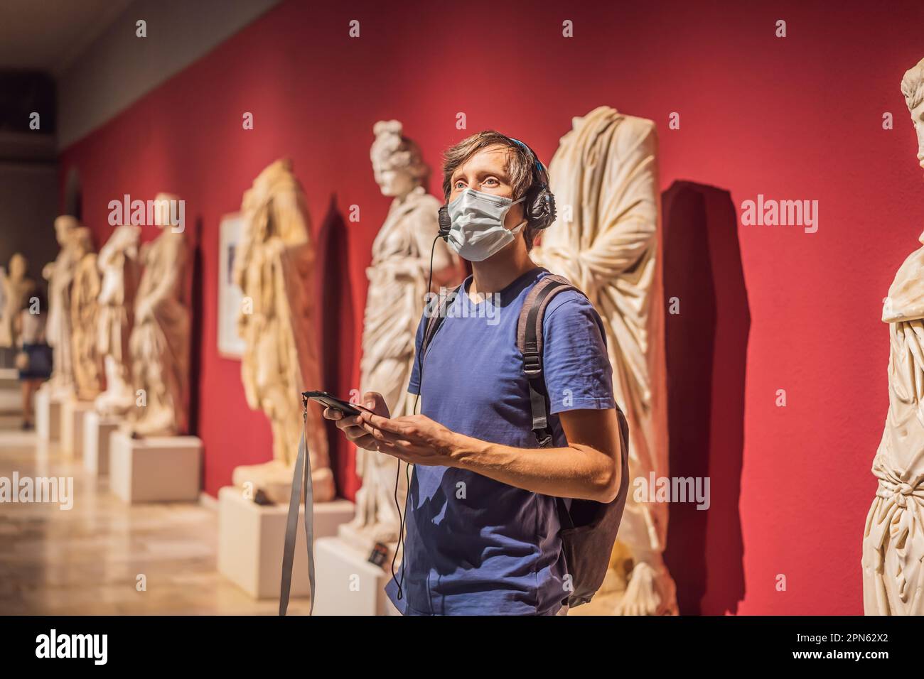 Visitor listening audio guide hi-res stock photography and images - Alamy