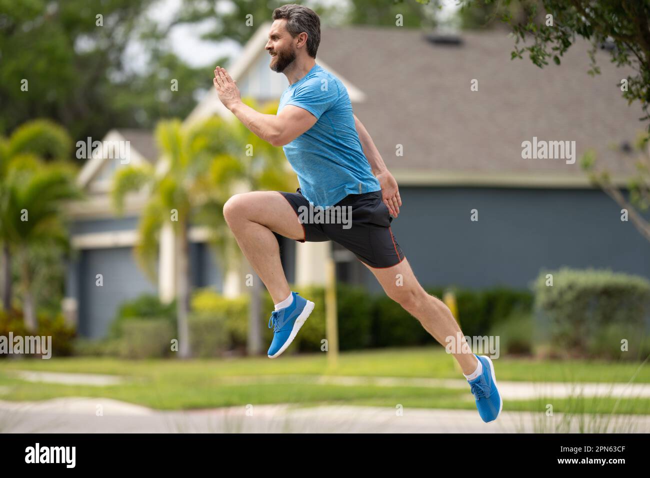 Sporty young man running across hi-res stock photography and images - Alamy