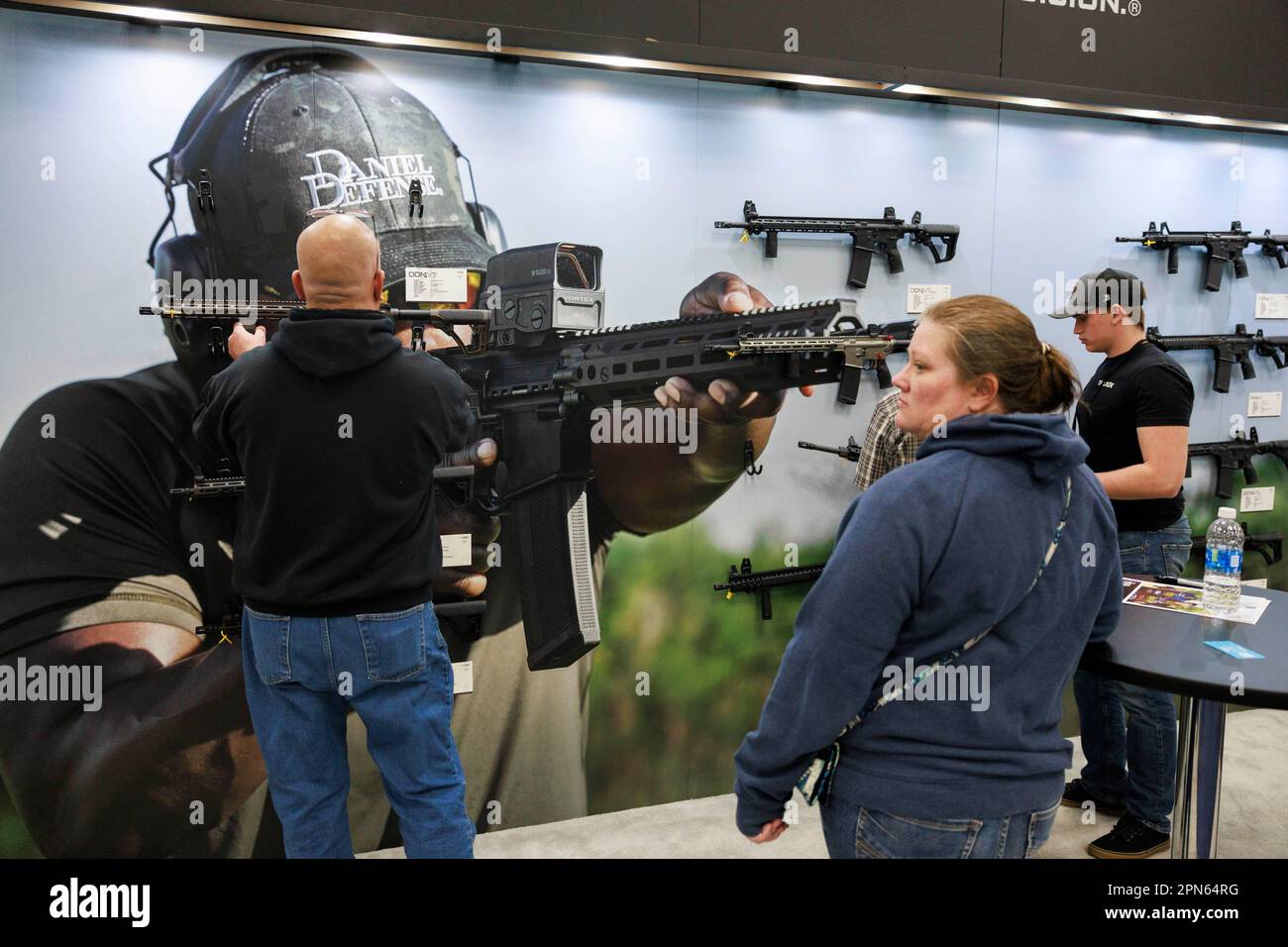 INDIANAPOLIS, INDIANA - APRIL 16: Guests look at rifles at the Daniel ...
