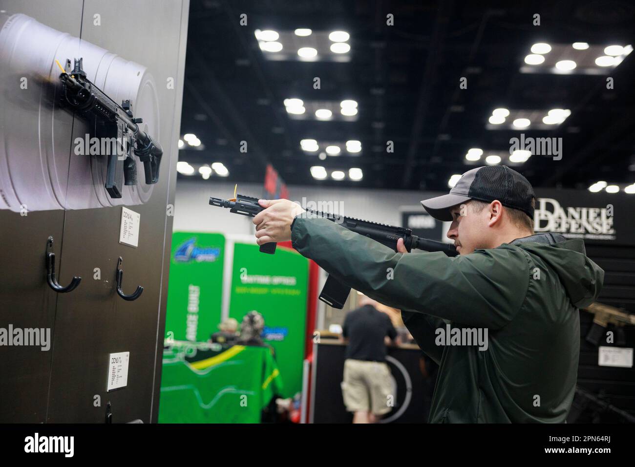INDIANAPOLIS, INDIANA - APRIL 16: A guest looks at a rifle at the ...